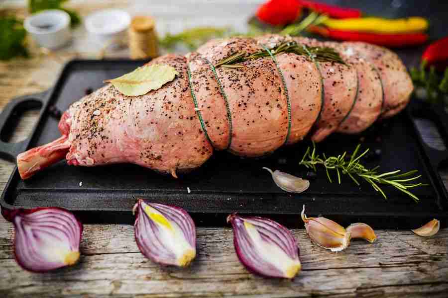 Lamb meat – leg of lamb with rosemary and spices, ready for roas ...